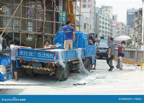 Loading And Unloading Work With A Grab With A Manipulator Metal Editorial Photo CartoonDealer
