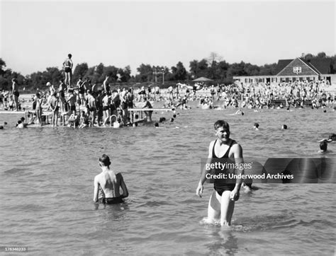 A Crowd Of People At The Swimming Pool In Cermak Park In Chicago