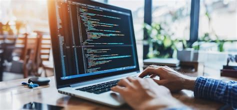 Programming In A Bright Workspace While Using A Laptop With Colorful