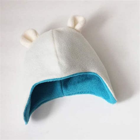 A White And Blue Hat With Ears On It