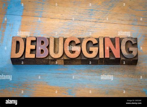 Debugging Word Abstract In Vintage Letterpress Wood Type Against Grunge Wood Computer