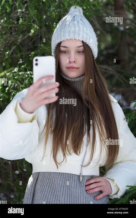 Teen Girl 17 Year Old Using Cell Phone In Vertical Orientation