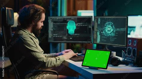Developer Using Green Screen Tablet Updating Artificial Intelligence