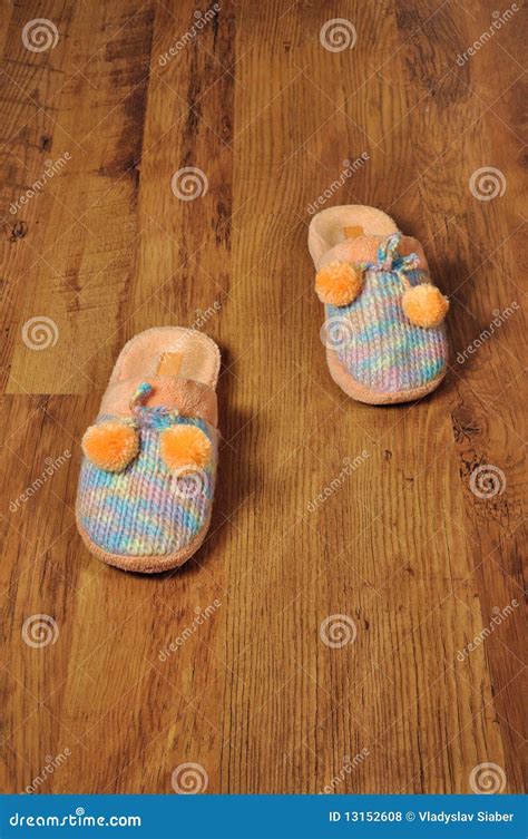Slipers on the oak floor stock photo. Image of bright - 13152608