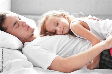Father And Daughter Sleeping In Bed Stock Photo Adobe Stock