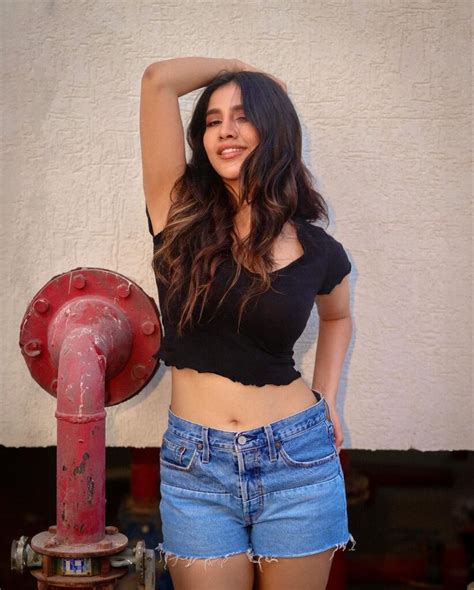 Nabha Natesh Hot In Chic Crop Top And Denim Shorts Photos