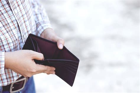Premium Photo Man Hand Open An Empty Wallet Isolated