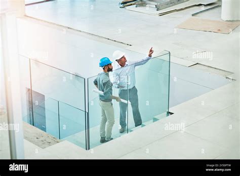 Architecture Construction And Business Men With Discussion And Tablet Blueprint Building