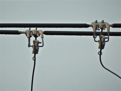 Low Angle View Of Electric Lamp Against Sky Premium Photo