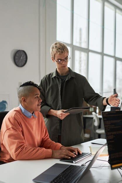 Premium Photo Colleagues Discussing Codes Of Software