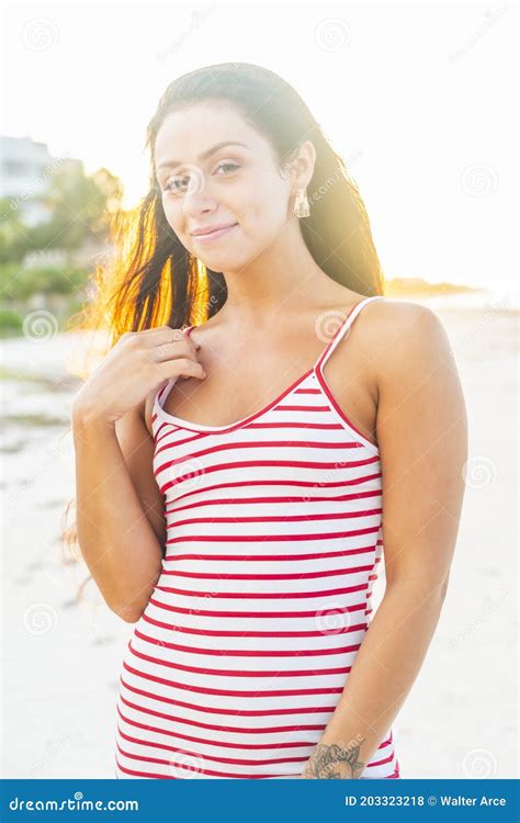 A Lovely Brunette Model Enjoys The Sunset While On Vacation In The