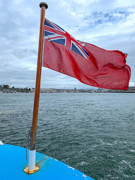 Premium Photo Red Ensign Flag On Flagpole On Boat Sailing In Sea