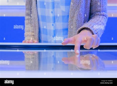 Woman Using Interactive Touchscreen Display At Technology Exhibition Stock Photo Alamy