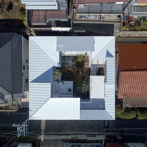 Monolithic Black House By Apollo Architects Conceals Internal Courtyard
