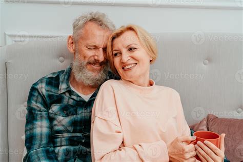 Husband And Wife Have Breakfast With Coffee On The Bed At Home 20559642