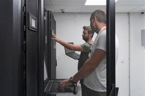 Premium Photo A Couple Of Server Engineers Cooperate In High Tech