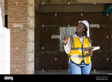 African Black Women Worker Work In Construction Site For Site Inspector Job Checking Project