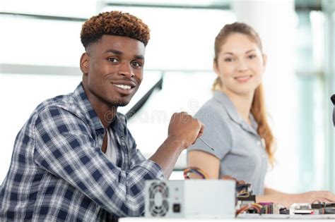 Female Male Technicians Fixing Devices Stock Photos Free Royalty Free Stock Photos From