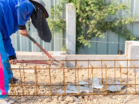 Worker Is Cutting Reinforcement Rebar Steel Work With Bolt Cutters