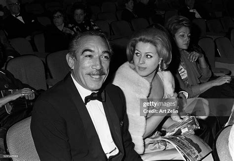 Anthony Quinn With His Wife Jolanda Addolori Seated In A Theater For