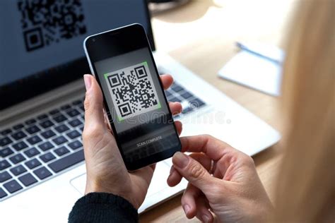 Scanning QR Code From The Screen Of Laptop With A Phone Stock Photo Image Of Mobility