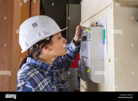 Woman Measuring Electrical Current Stock Photo Alamy