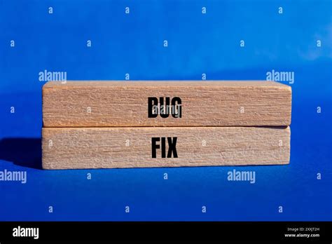 Bug Fix Message Written On Wooden Blocks With Blue Background
