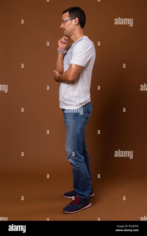 Full Body Side View Shot Of Handsome Man Thinking Stock Photo Alamy