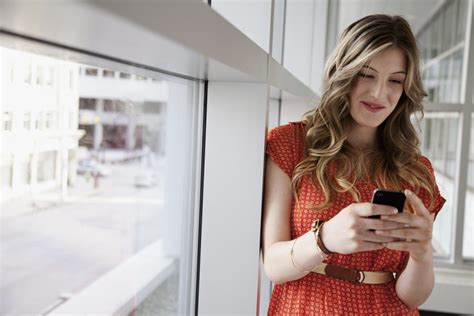 Pretty Office Worker Text Messaging Hola Telcel