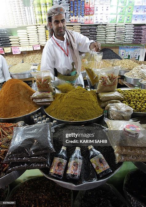 A Yemeni Vendor Sells Spices At A Stall In The Pavilions Of The News