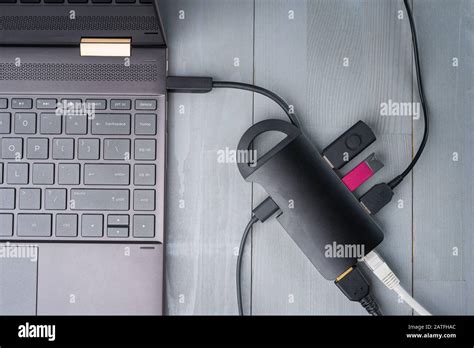 USB Type C Adapter Or Hub Connected To The Laptop With Various