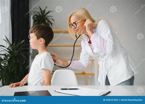 Female Doctor Examining Boy By Stethoscope Stock Image Image Of