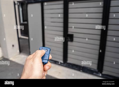 Using Remote Control To Open Electric Gate Stock Photo Alamy
