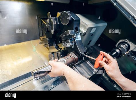 Changing The Tool Setup In Lathe Machine In Production Close Up On Hands Stock Photo Alamy