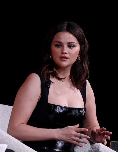 Selena Gomez suffers wardrobe malfunction as star accidentally bares too much in white robe ...