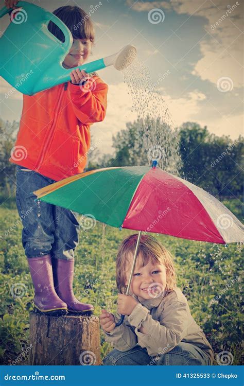 Two Brothers Play In Rain Stock Image Image Of Outdoors 41325533