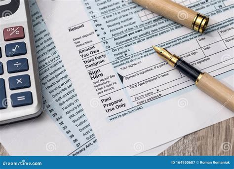 1040 Tax Form With Calculator And Pen Editorial Photography Image Of