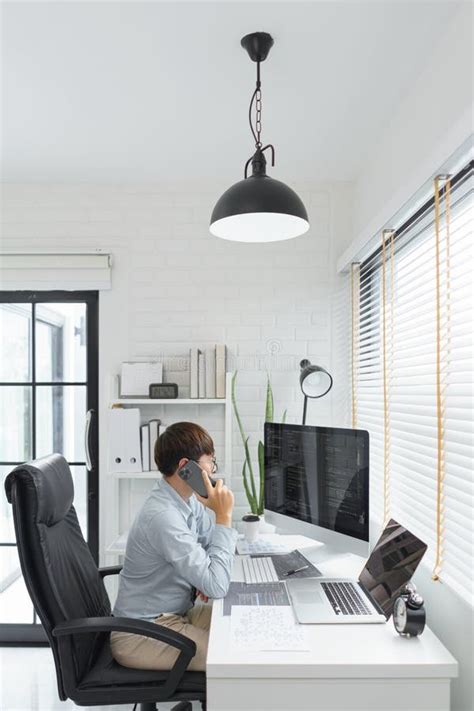 Software Development Concept Male Programmer Talking On Smartphone And Check Data Code On