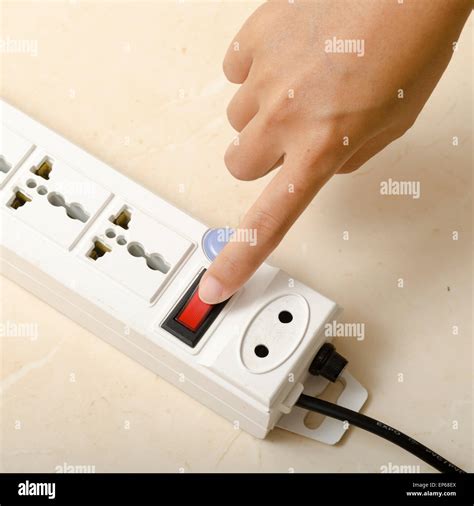 Asia Woman Hand Turn On Switch Multiple Socket Plug Electric Stock Photo Alamy