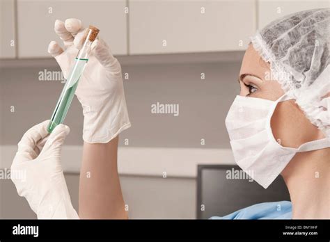 Female Lab Technician Analyzing A Sample In A Test Tube Stock Photo Alamy