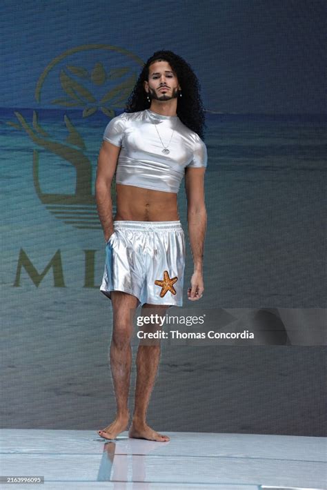 A Model Walks The Runway Wearing Mlc Swimwear During New York Swim