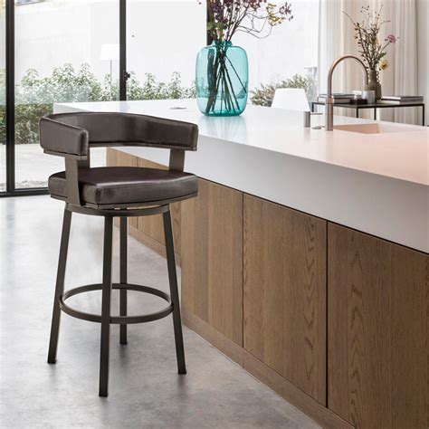 Wade Logan® Kellum Swivel Counter And Bar Height Barstool With Arms In Faux Leather Upholstery