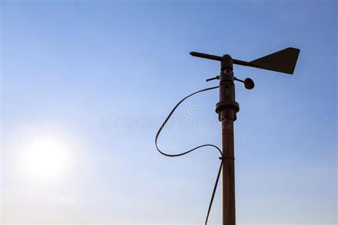 Wind Wheel And Anemometer On The Background Of Clear Blue Sky Stock