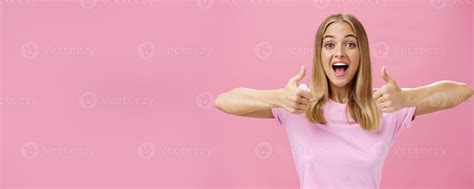 Supportive Girlfriend Cheering For Favorite Player Showing Thumbs Up