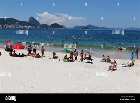 Copacabana Beach Rio De Janeiro Brazil People Sunbathing Near Sea