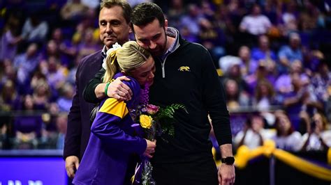 Emotional Olivia Dunne Hugs Coach After Missing Senior Night Due To