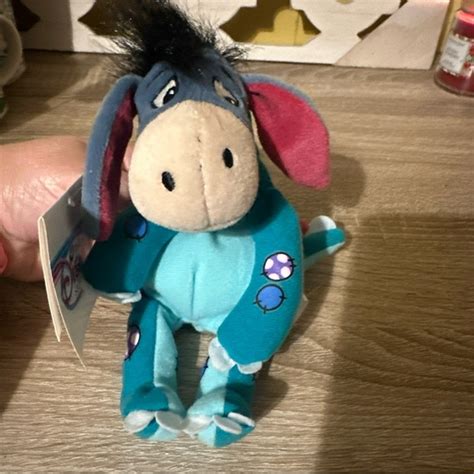 Disney Toys Disney Eeyore Dinosaur Plush With Blue And Purple