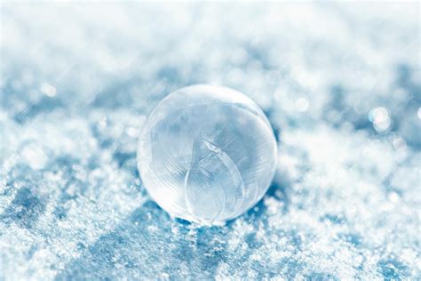 Premium Photo Frozen Bubble With Bokeh Background Beautiful Frosty Patterns On Frozen Soap Bubble