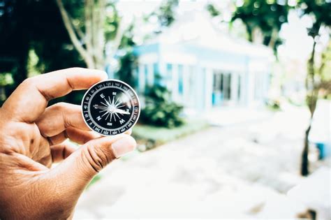 Premium Photo Cropped Hand Holding Navigational Compass