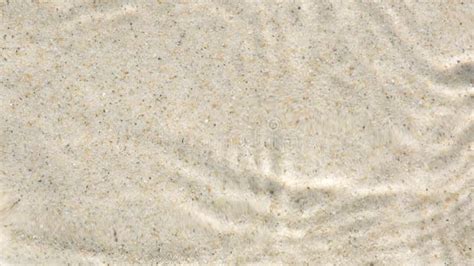 Waterline Washes Over Beach Sand Forming Tiny Symmetrical Ripples The Light Refraction Creates